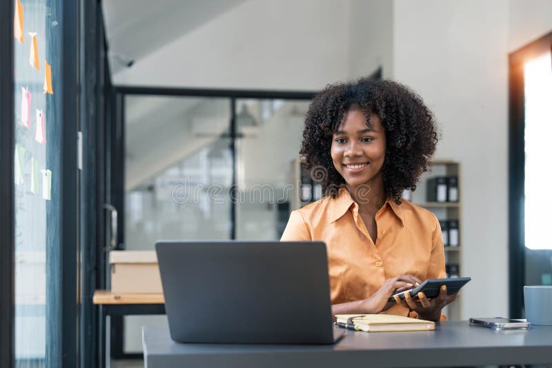 Confident Ethnic Businesswoman Using Laptop at Work, Thinking and ...
