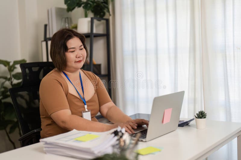 Confident Female Accountant Analyzing Financial Documents in Modern ...