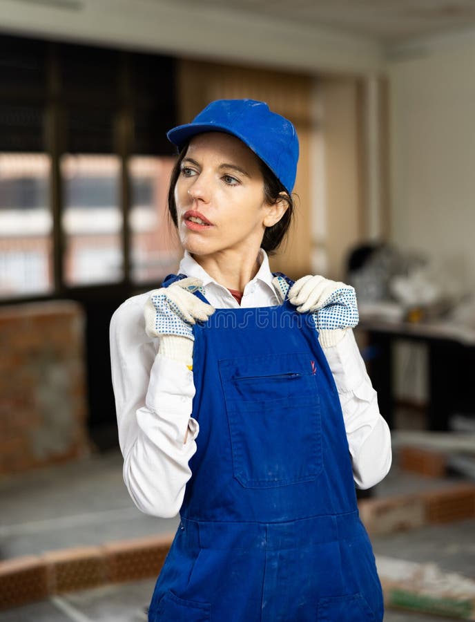 Confident Female Builder Posing at Construction Site Indoors Stock ...