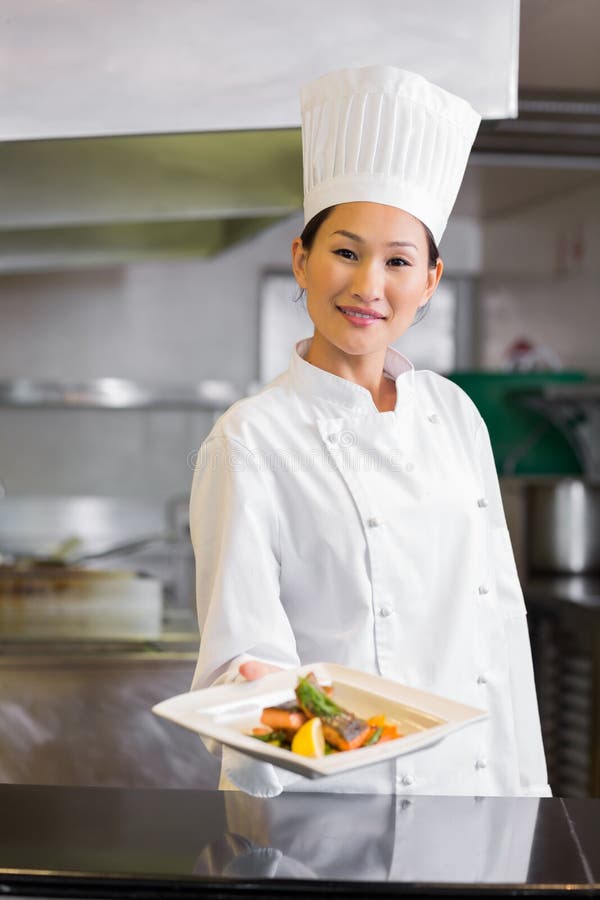 Confident Female Chef Holding Cooked Food in Kitchen Stock Photo ...