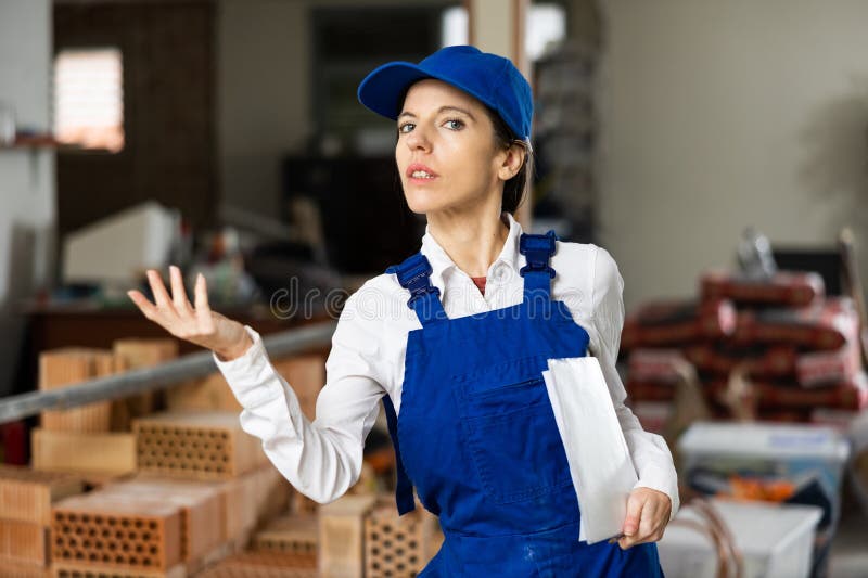 Female Contractor Showing Customer Amount of Work Done at Construction ...