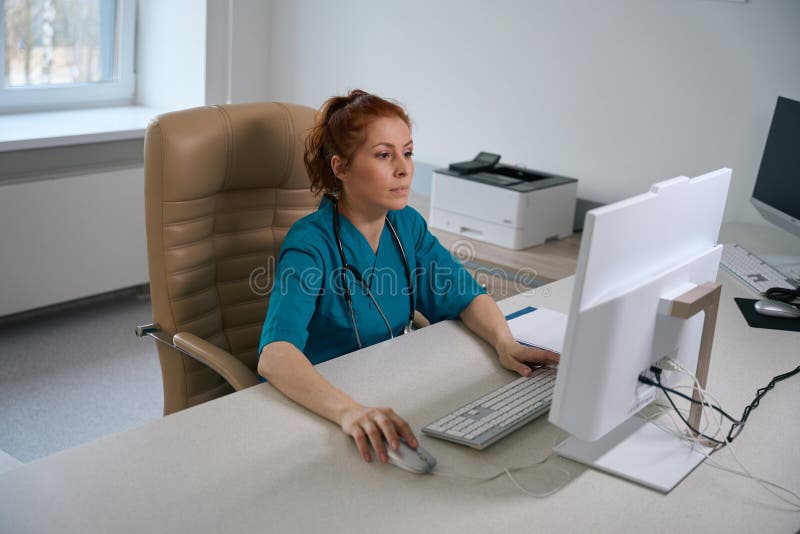 Female Doctor Working on the Computer in Office at the Clinic Stock ...