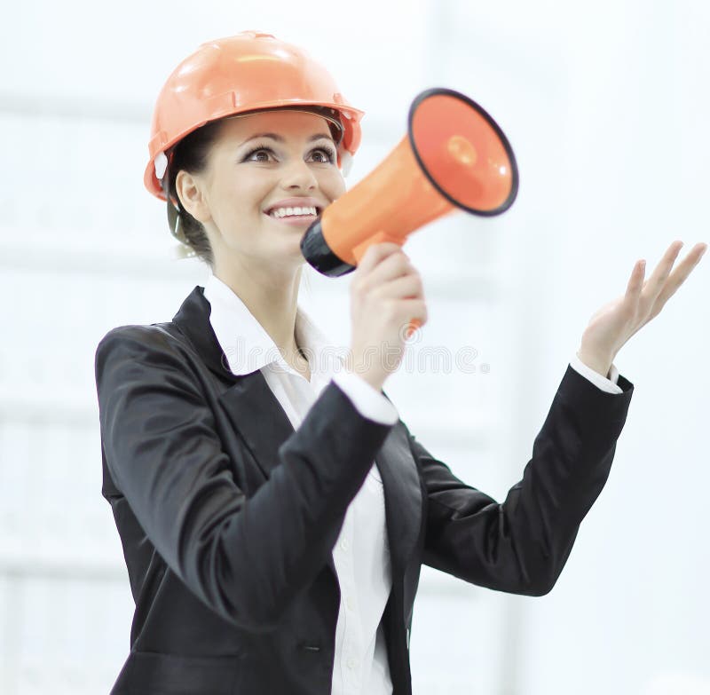 Confident Female Engineer with a Megaphone on the Background of the ...