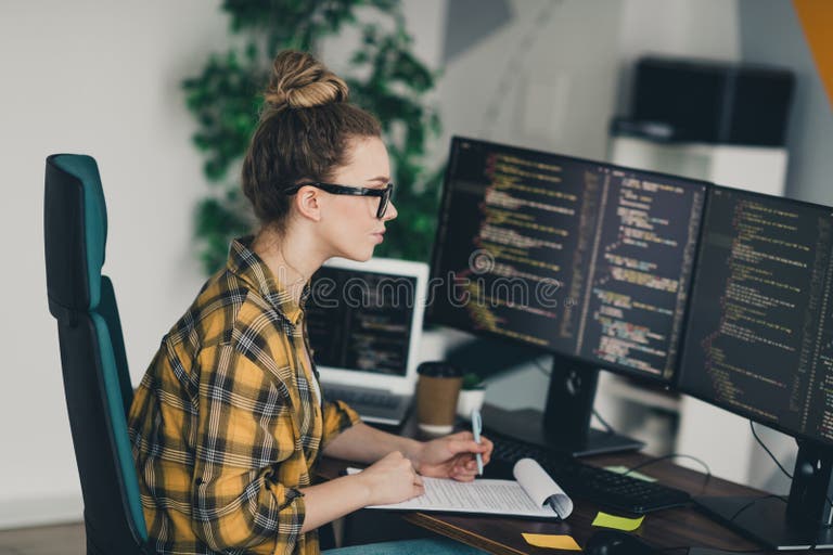 Confident Female Programmer Working on Software Code Using Multiple ...