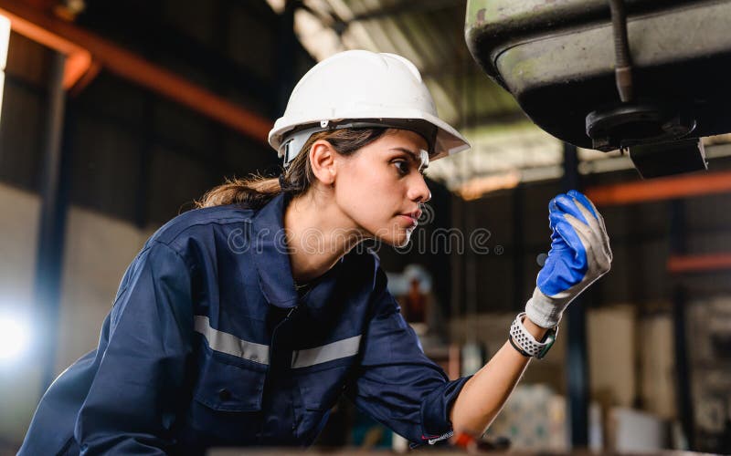 Confident Female Technician Engineer Worker Checking and Inspecting ... Confident Female Technician Engineer Worker Checking and Inspecting ...