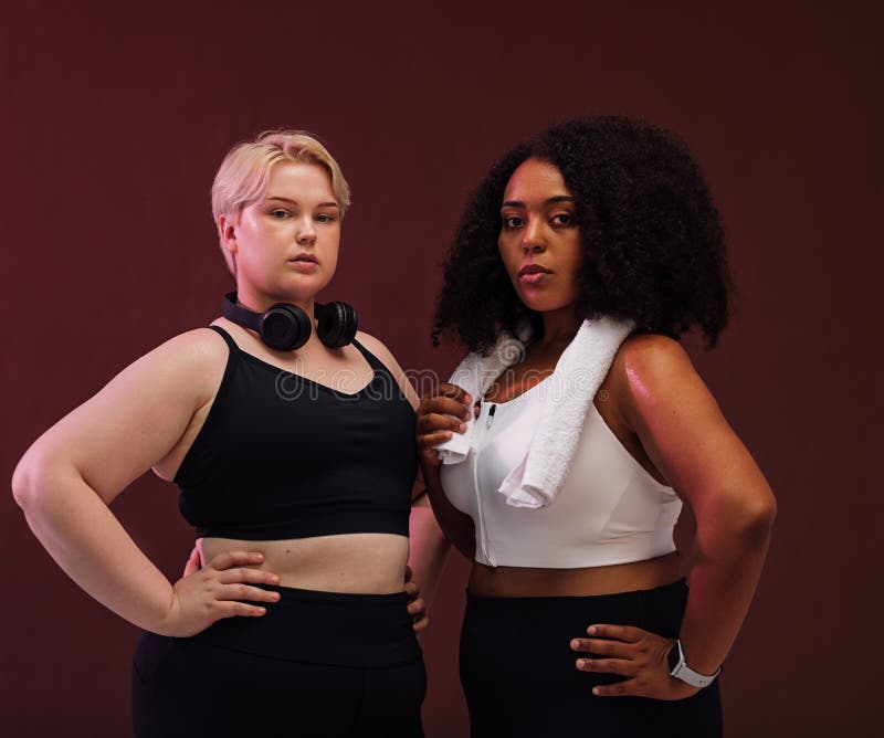 Confident Females with Plus Size Bodies Standing Together in Studio and ...