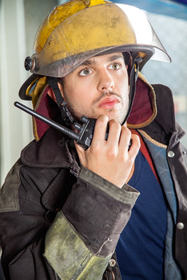 Confident Fireman Using Walkie Talkie Stock Image - Image of firehall ...