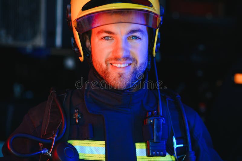 Confident Fireman Wearing Protective Uniform Standing Next To a Fire ...