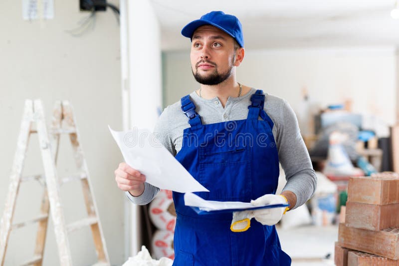 Foreman Reading Papers Indoor Construction Site Stock Photos - Free ...
