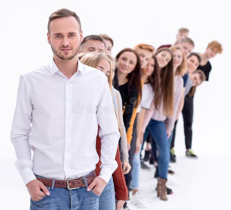 Confident Guy Standing First in the Column of Young People Stock Photo ...