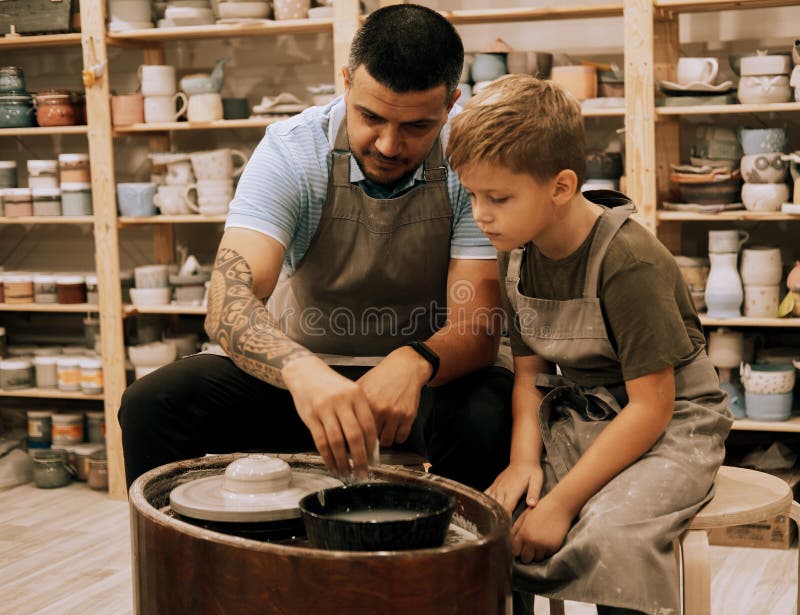 Confident Handsome Man and Little Boy Making Ceramic Pot on the Pottery ...