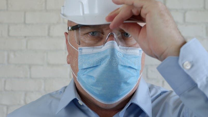 Confident Image with an Engineer Wearing Face Protection Mask Against ...