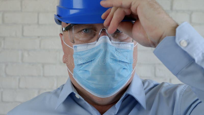 Confident Image with an Engineer Wearing Face Protection Mask Against ...