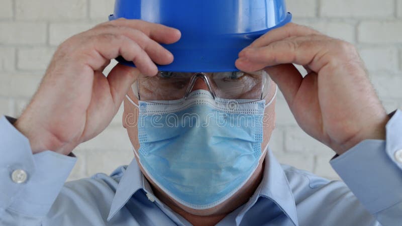Confident Image with an Engineer Wearing Face Protection Mask Against ...