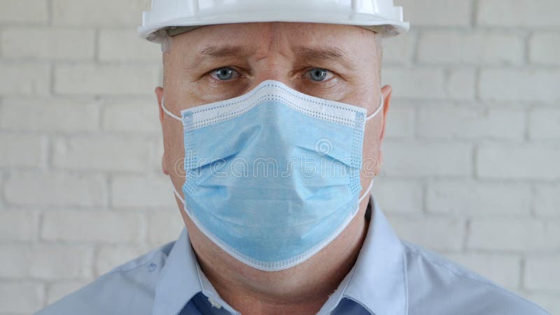 Confident Image with an Engineer Wearing Face Protection Mask Against ...