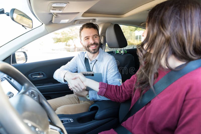 Giving Self Introduction with a Handshake in Car Stock Image - Image of ...