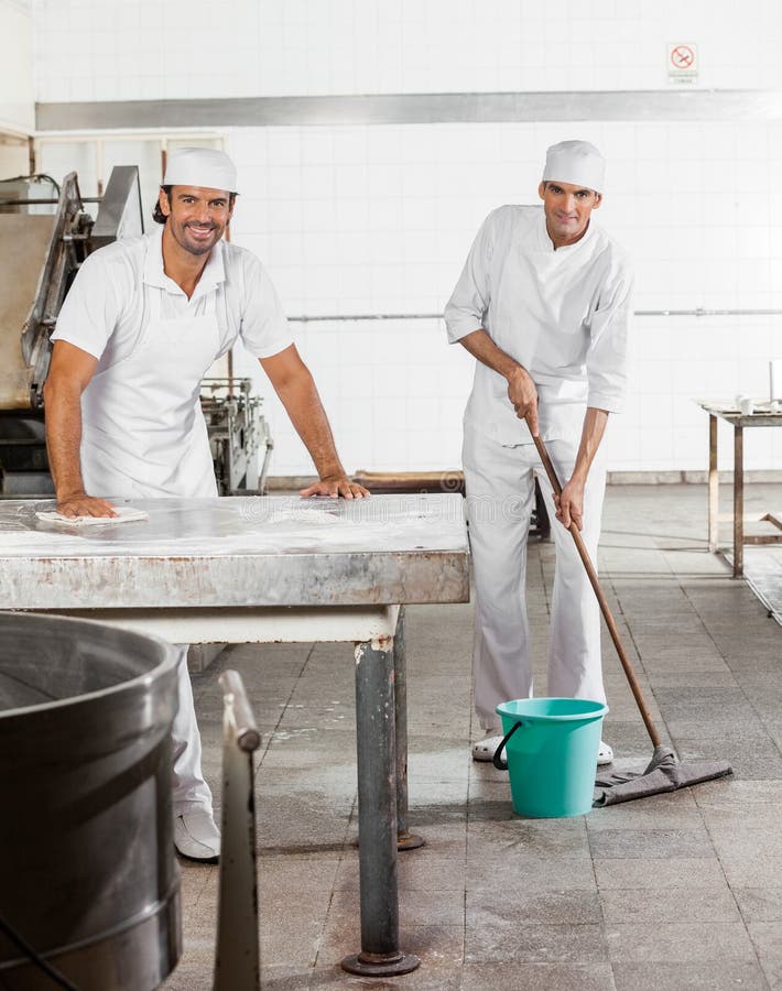 Confident Male Baker S in Uniform Cleaning Bakery Stock Image - Image ...