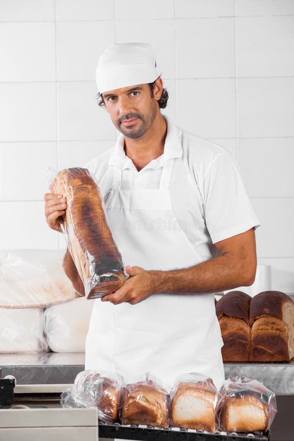 Confident Male Baker Showing Packed Breads Stock Photo - Image of male ...