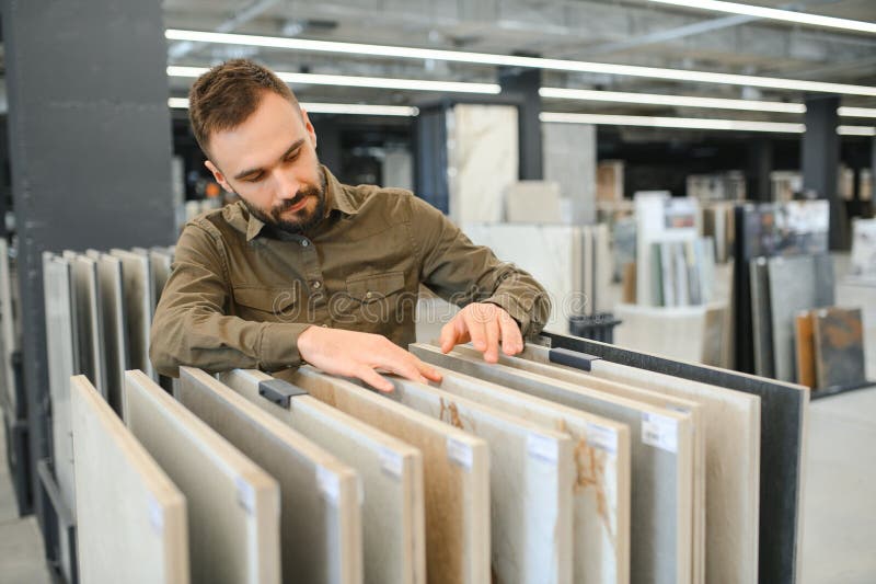 Confident Male Customer Picking Out Wall Tile Materials for Bathroom in ...