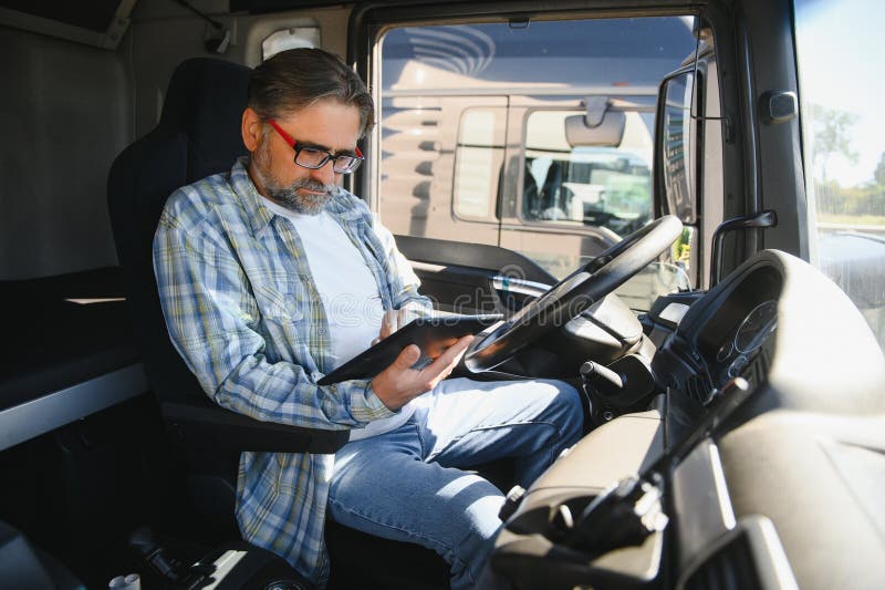 Confident Male Driver Sitting in His Truck, Using His Tablet Stock ...