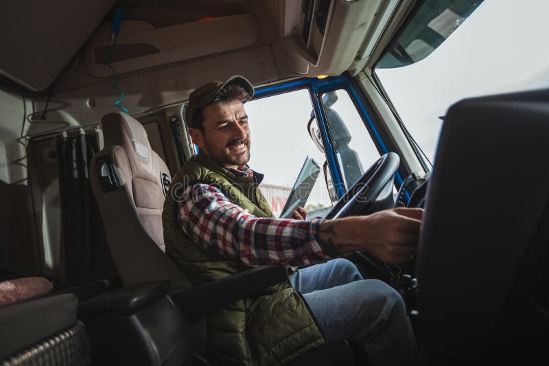Confident Male Driver Sitting in His Truck, Using His Tablet Stock ...