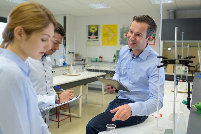 Confident Male Medical Student Talking with Teacher Stock Photo - Image ...
