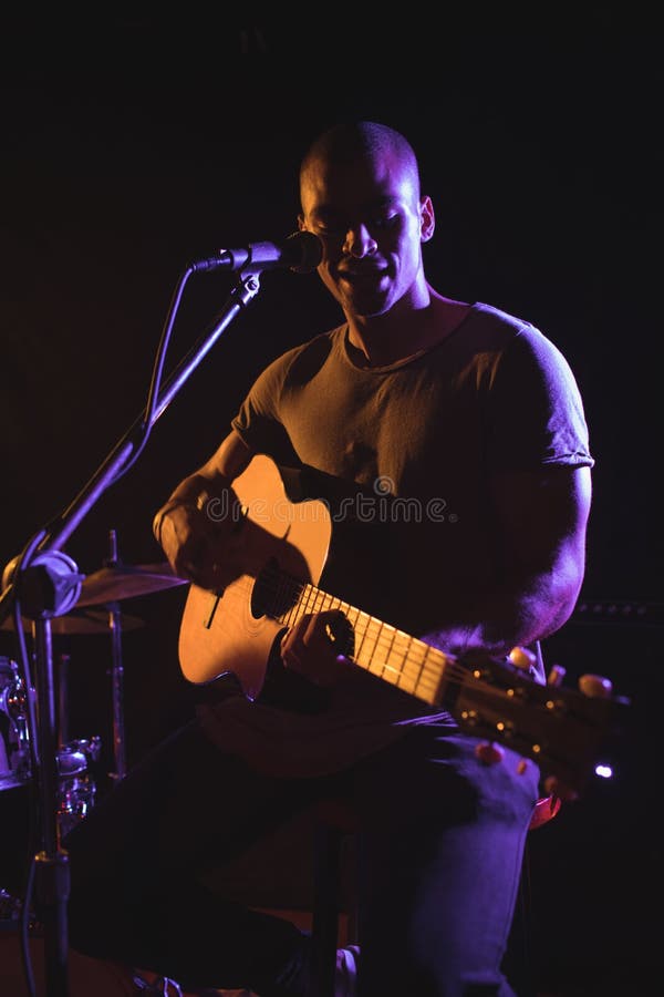 Confident Male Singer Playing Guitar Stock Image - Image of concert ...