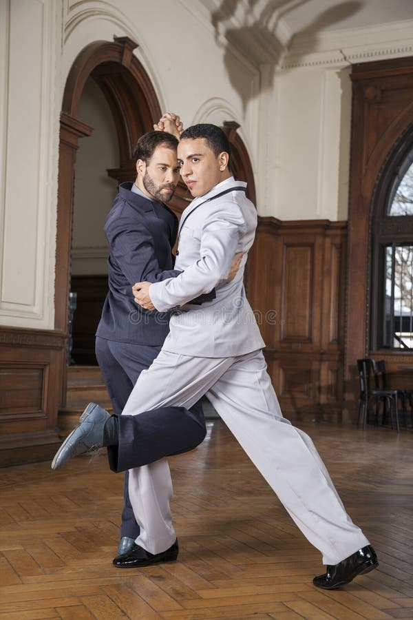 Confident Male Tango Dancers Performing Gancho Stock Image - Image of ...
