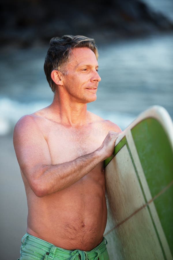 Confident Man with Green Surfboard Stock Photo - Image of adult ...