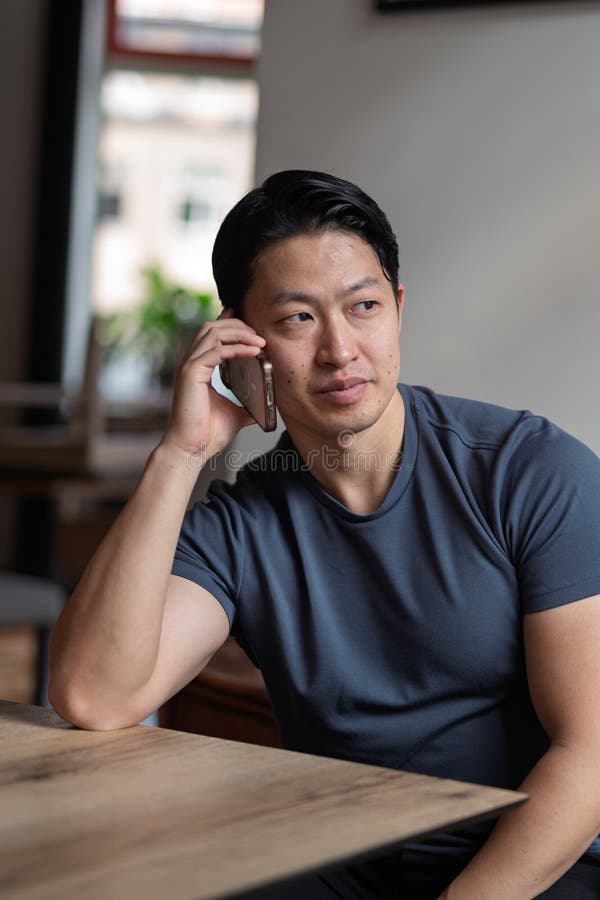 Confident Man Having Phone Call at Cafe Table. Stock Image - Image of ...