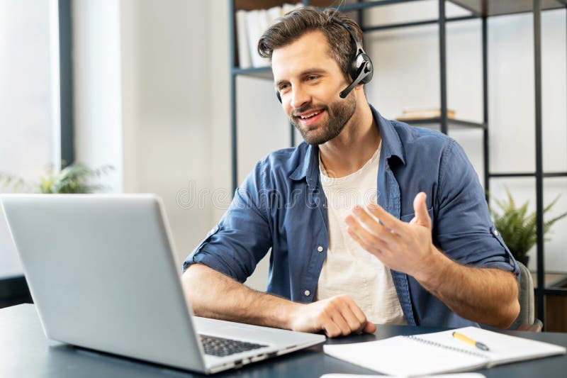 Confident Man with Headset Talking in Front of Computer Stock Photo ...