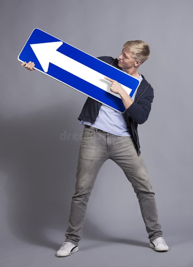 Pleased Man Holding Direction Arrow Sign Pointing Up. Stock Image ...