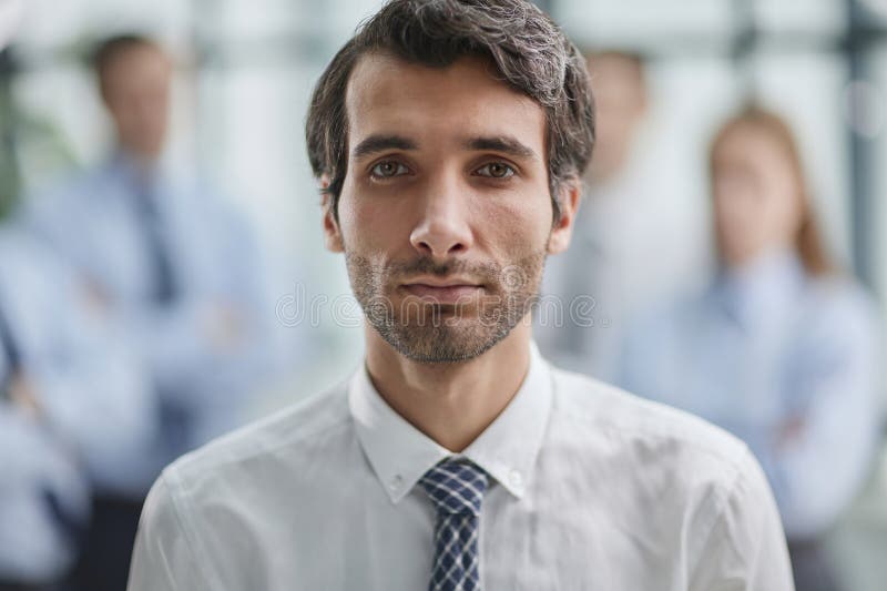 Confident Man Posing In Front Of His Colleague During A Meeting Stock