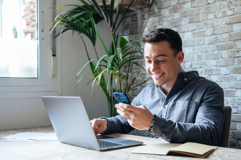 Confident Man Sitting at Desk Taking Break in Work with Electronic ...