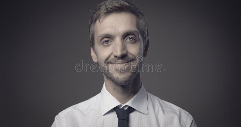 Confident Man Smiling and Looking at Camera Stock Photo - Image of ...