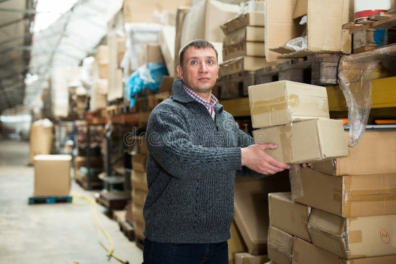 Man Warehouse Worker Carrying Boxes Stock Photo - Image of carrying ...