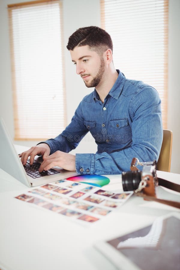 Confident Man Working at Office Stock Image - Image of editing ...