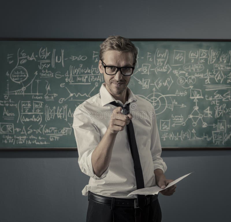 Confident Math Professor Teaching in Front of the Chalkboard Stock ...
