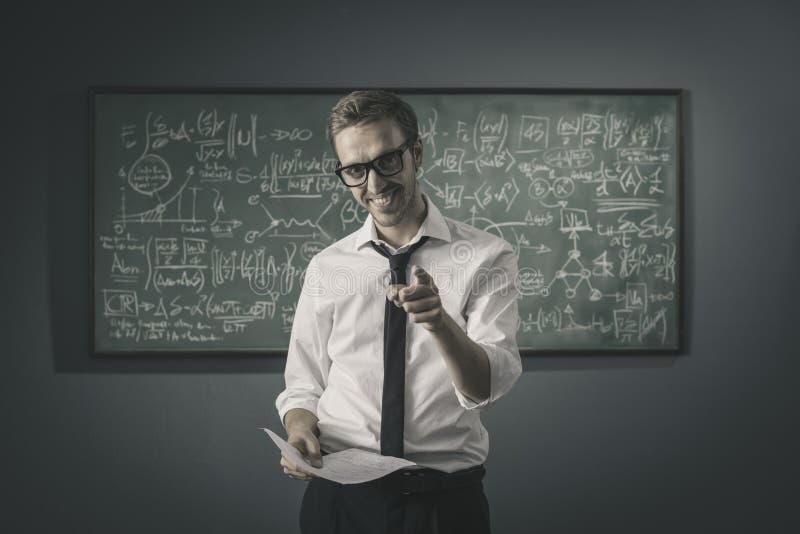 Confident Math Professor Teaching in Front of the Chalkboard Stock ...