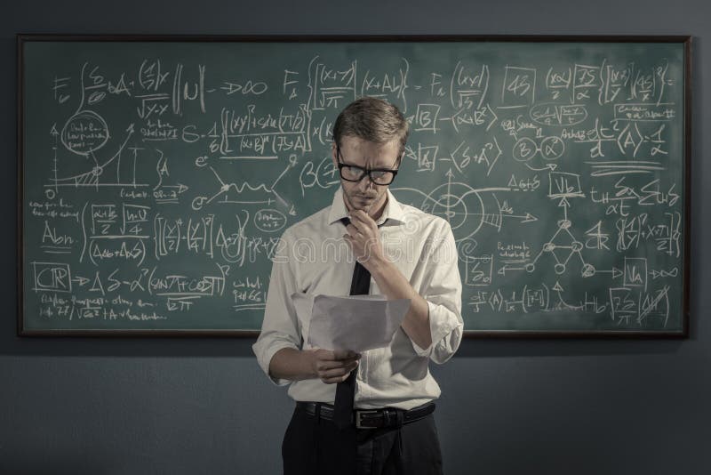Confident Math Professor Teaching in Front of the Chalkboard Stock ...