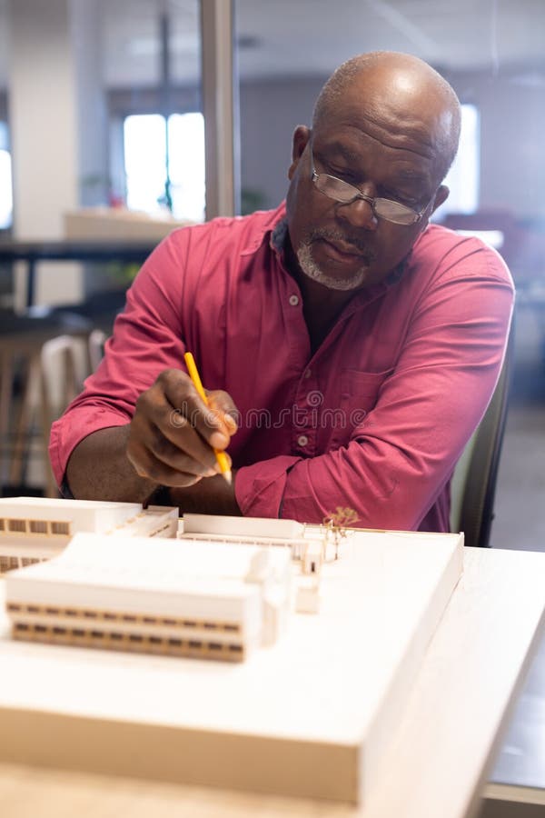 Confident Mature African American Architect Analyzing Model at Desk in ...
