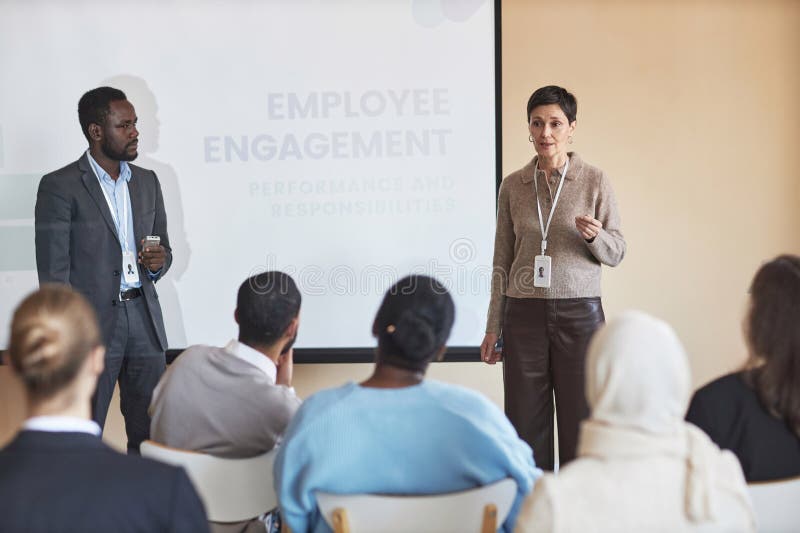 Confident Mature Female HR Manager Standing by Whiteboard in Front of ...