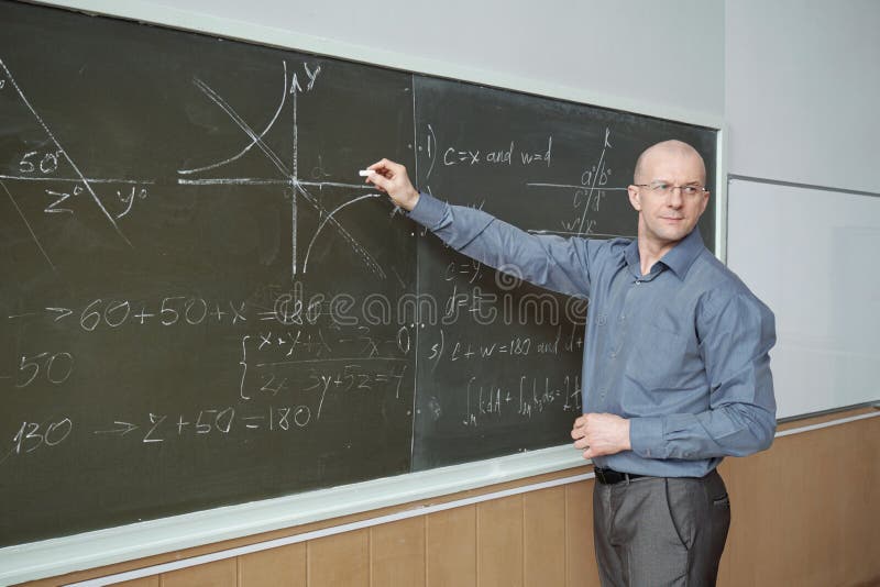 Confident Mature Professor Standing in Front of Blackboard in Lecture ...