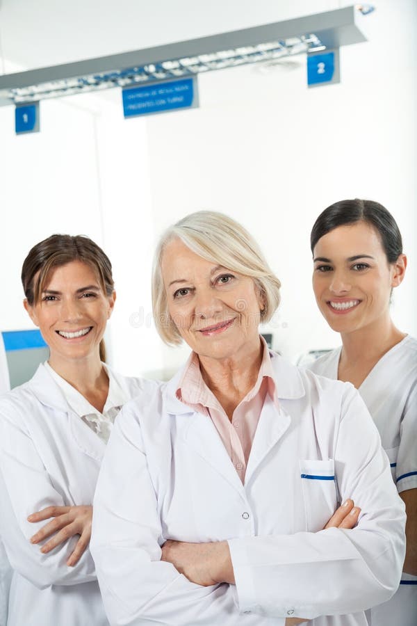 Confident Medical Team Smiling while Standing by MRI Machine Stock ...
