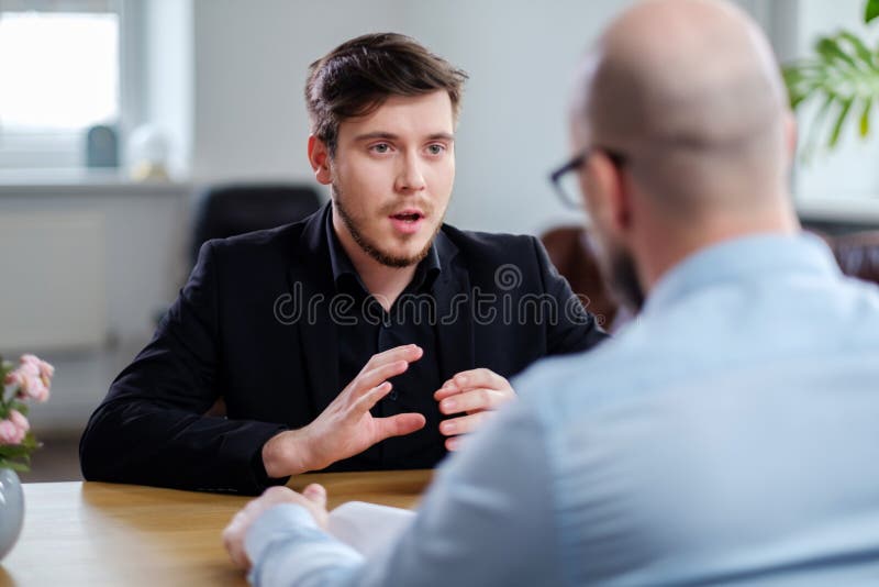 Confident Young Man Attending Job Interview Stock Photo - Image of ...