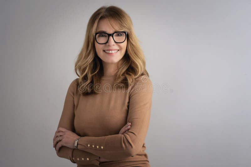 Blond Haired Mature Woman Wearing Eyewear And Casual Clothes And