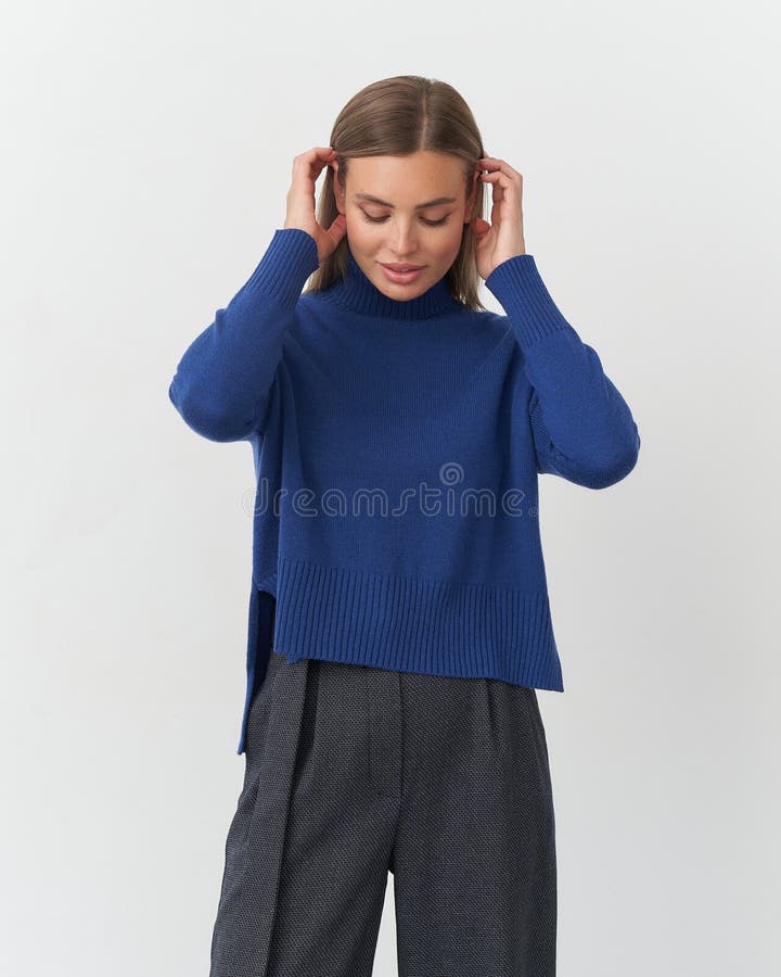 Stylish Woman Poses Gracefully in a Modern Studio Wearing a Vibrant ...