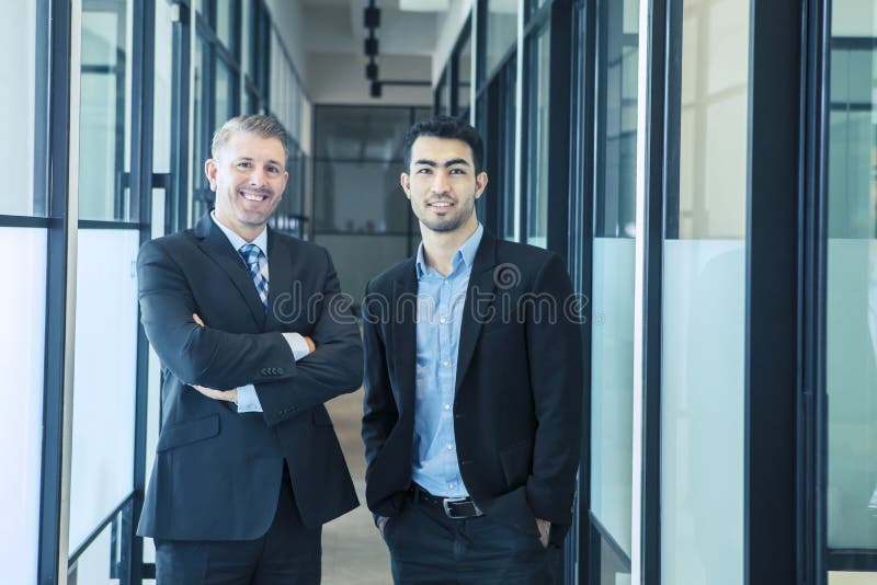 Confident Multiethnic Businessmen Standing in Office Stock Photo ...
