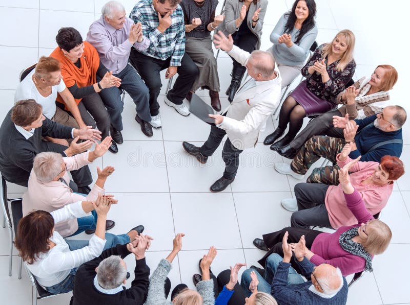 Confident Older Man Standing in a Circle of Like-minded People Stock ...