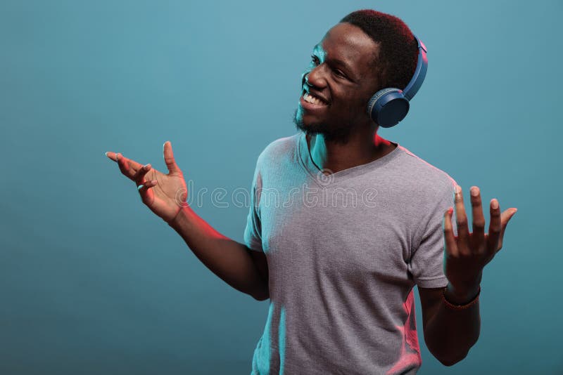 Confident Person Smiling and Enjoying Radio Music on Headset Stock ... Confident Person Smiling and Enjoying Radio Music on Headset Stock ...